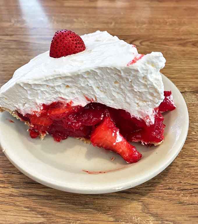Strawberry Cream Pie: A vision in red and white &ndash; plump strawberries peeking through billowy cream, creating a dessert that's both elegant and comforting.