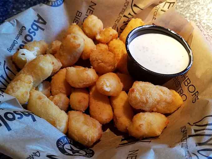 Golden cheese curds deliver that signature Midwest stretch, crispy outside and gloriously gooey within.
