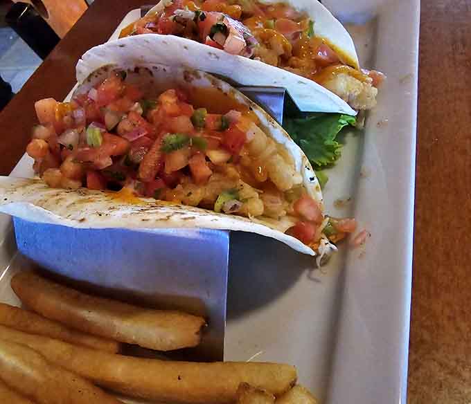 Fresh pico de gallo crowning those fish tacos like the jewels they are, with rice playing the perfect supporting role.