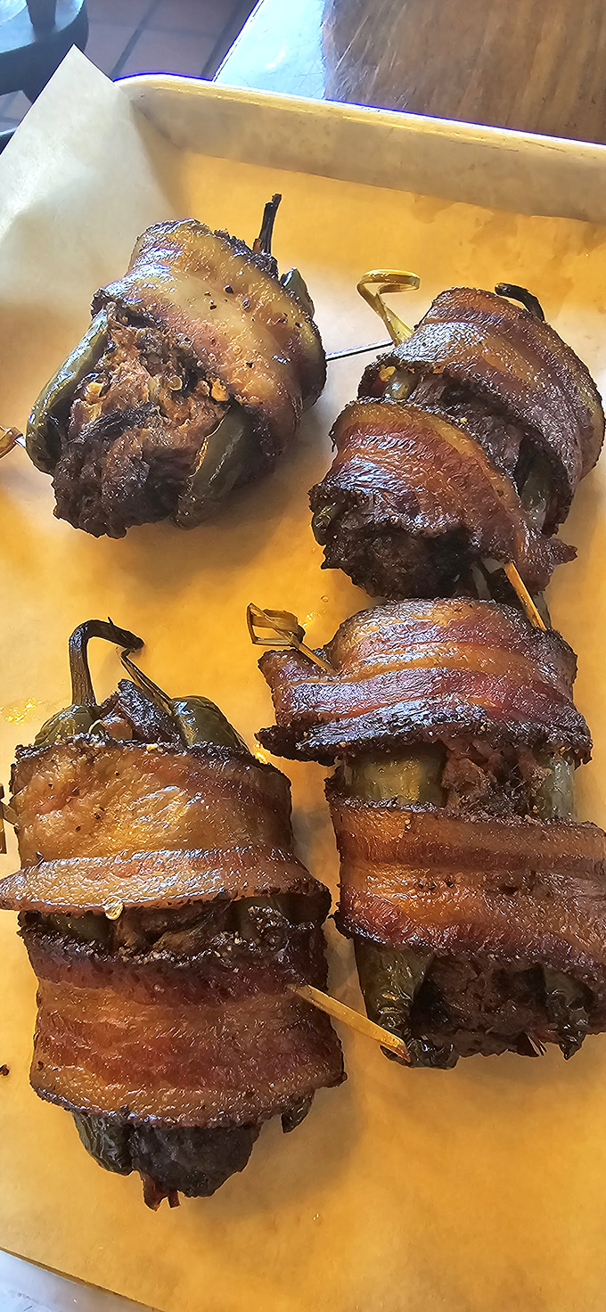 Bacon-wrapped jalape&ntilde;os &ndash; little flavor bombs where smoke meets heat in a dance that makes your taste buds tango.