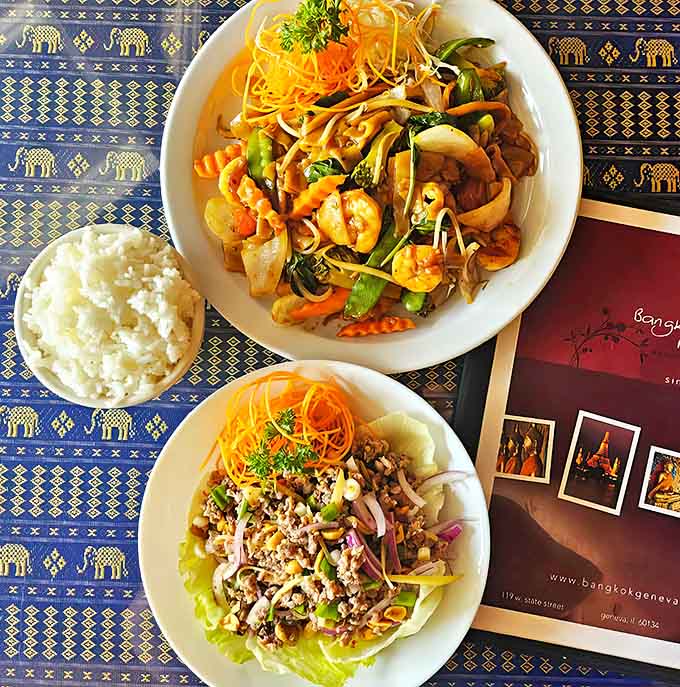 A feast for both eyes and stomach: vibrant stir-fried dishes showcase the colorful, fresh ingredients that make Thai cuisine a sensory celebration.