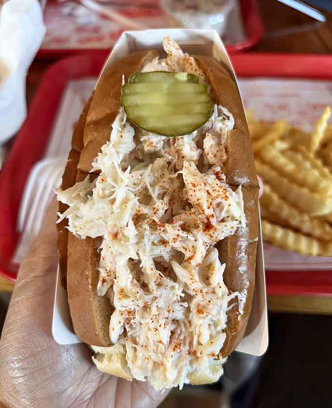 The crab roll boat overflows with sweet crabmeat, offering another delicious way to enjoy Maine's coastal bounty.