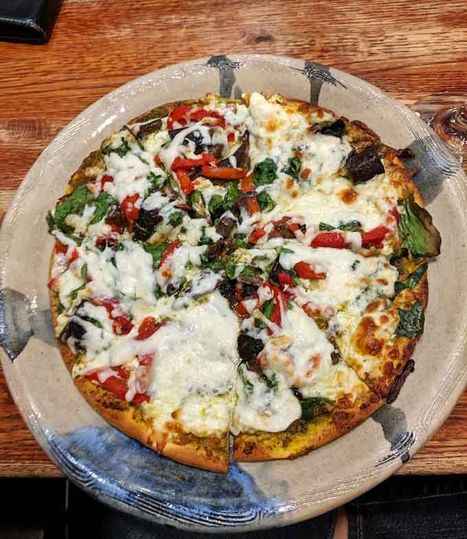 Melted cheese and fresh vegetables on a crispy crust make this pizza proof that coffee shops can do serious food.