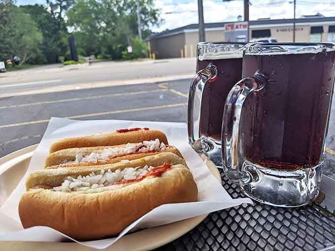 The classic combo &ndash; a hot dog with all the fixings alongside a mug of root beer, creating the perfect Michigan summer meal.