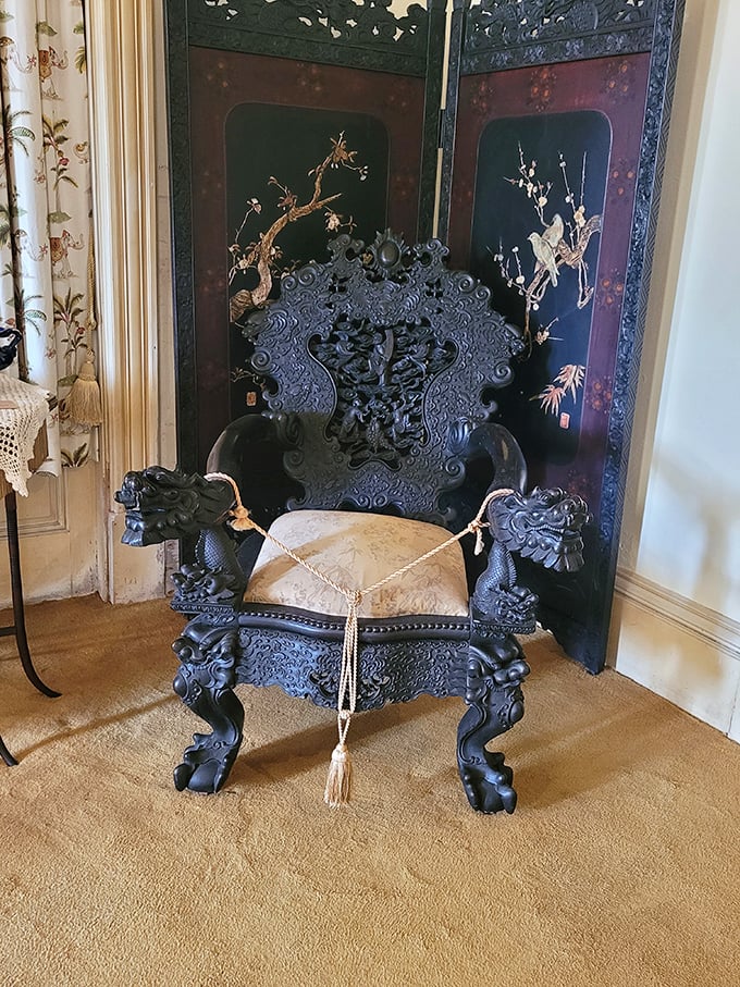 This ornately carved throne chair with dragon armrests isn't just furniture&mdash;it's what happens when someone takes "king of the castle" a bit too literally.