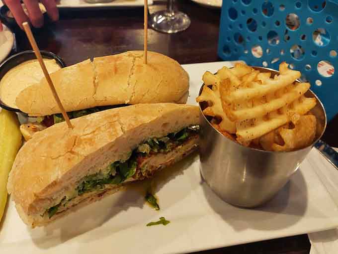 This chicken cutlet sandwich stacks up beautifully, offering layers of flavor that would make even your Italian grandmother nod with approval.