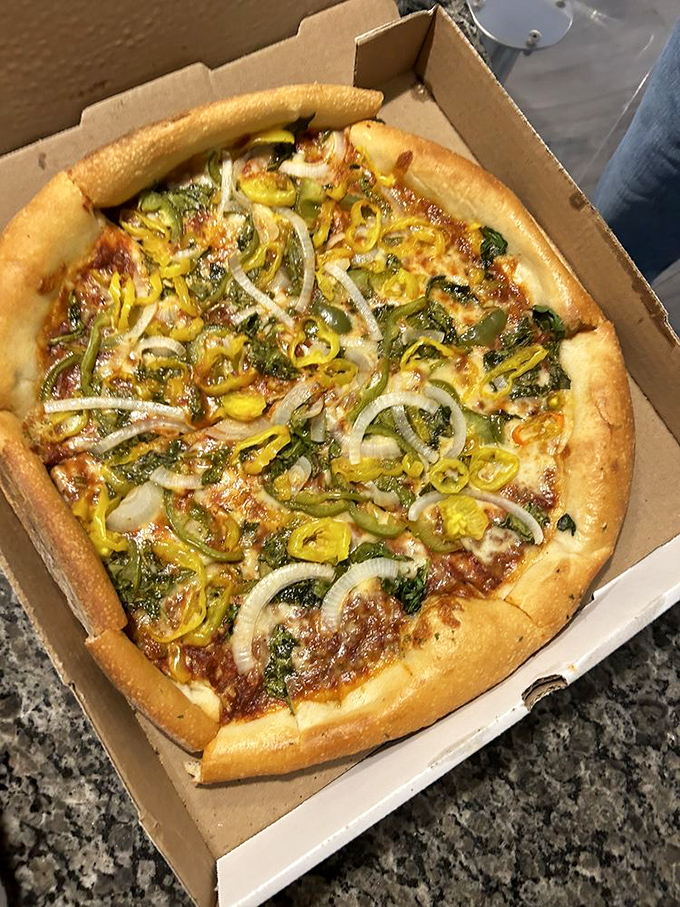 A veggie-lover's dream come true, with colorful bell peppers and onions creating a garden of delights atop a perfect cheese base.