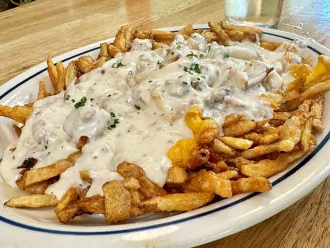 Poutine done right means crispy fries drowning in gravy, creating the kind of mess you'll happily make again.