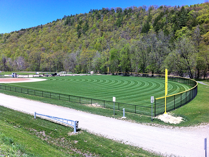 Living Memorial Park's pristine baseball field awaits future MVPs, surrounded by mountains that make even routine fly balls seem somehow more majestic.