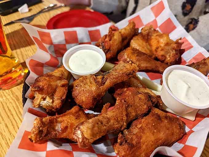 Golden-fried chicken wings arrive ready for action, demonstrating the kitchen's commitment to crispy perfection across the entire menu.