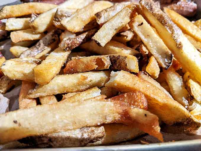 Hand-cut fries with that perfect golden crisp are the unsung heroes that complete your barbecue plate with crunchy, salty perfection.