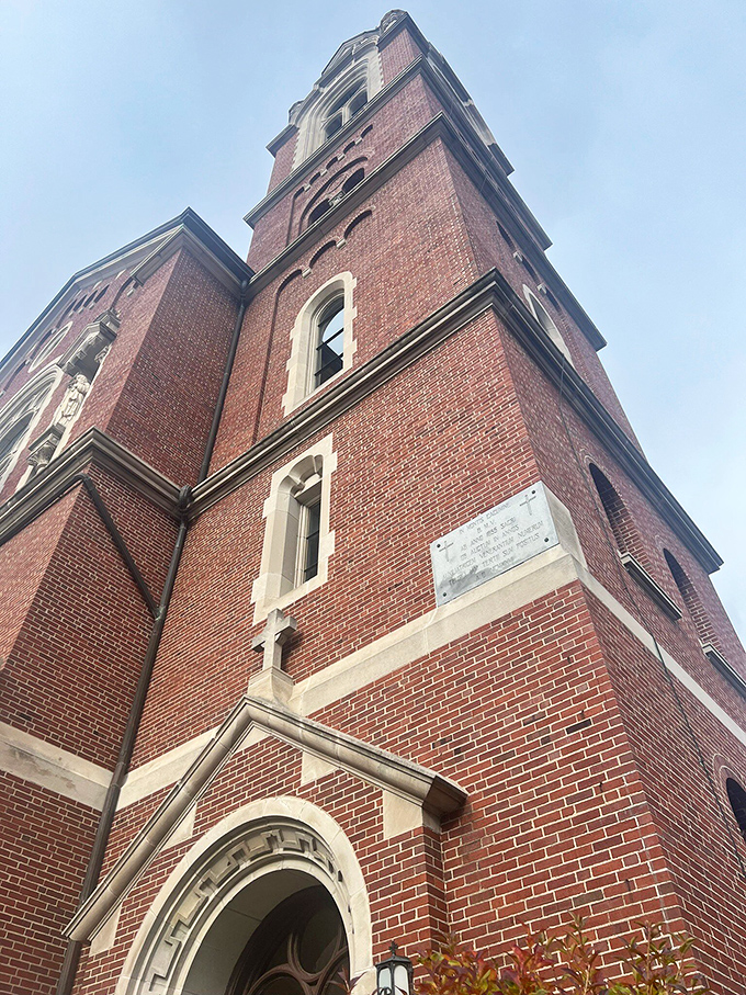 The basilica's impressive brick tower reaches skyward, its architectural details showcasing the craftsmanship that went into creating this Wisconsin landmark.
