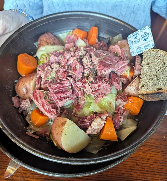 The corned beef and cabbage redefines the classic – tender meat that surrenders to your fork, alongside vegetables that have absorbed all that savory goodness.