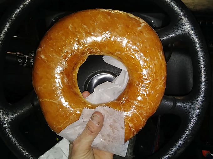 The glazed donut in its natural habitat &ndash; the car cupholder &ndash; ready to provide that perfect sugar rush for the Detroit commute.