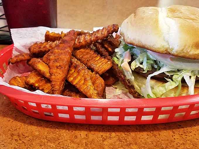 A burger and seasoned fries in a red basket is the kind of honest meal that never goes out of style, no matter what food trends come and go.