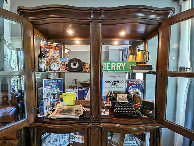 Even the display cabinets tell stories here, with carefully curated collections that nod to both the home's history and its famous film connection without going overboard.