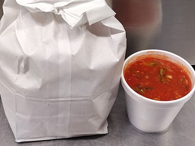 The anticipation builds: A simple white bag holds treasures within, while the salsa container promises added layers of flavor.