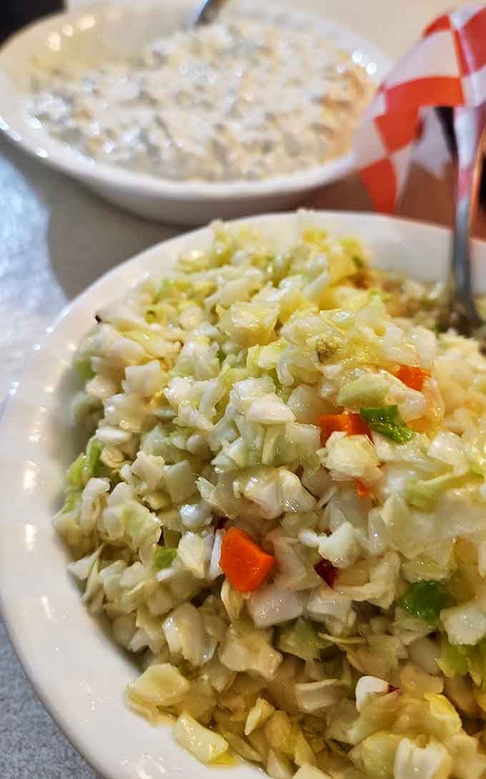 This isn't just coleslaw, it's a crisp, tangy palate cleanser between bites of that heavenly chicken. Notice the perfect dice on those vegetables!