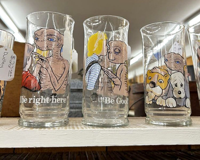 Vintage collectible glasses featuring beloved characters line the shelves, triggering waves of nostalgia for Saturday morning cartoons.