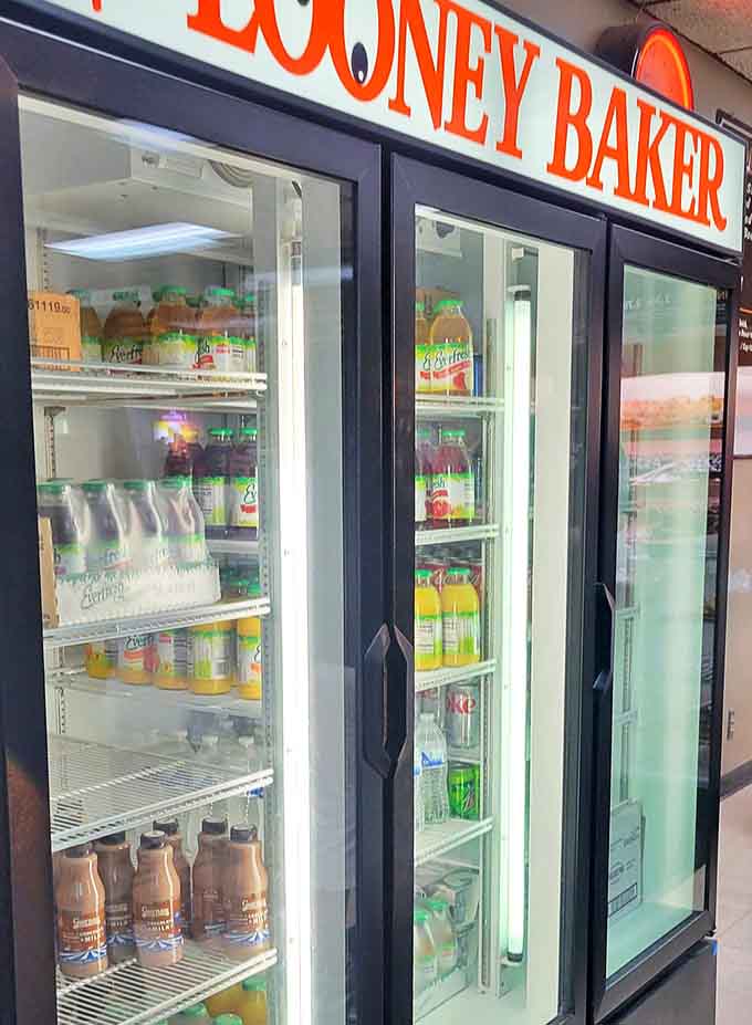 That beverage cooler is stocked like someone actually thought about what pairs well with donuts, which is everything.