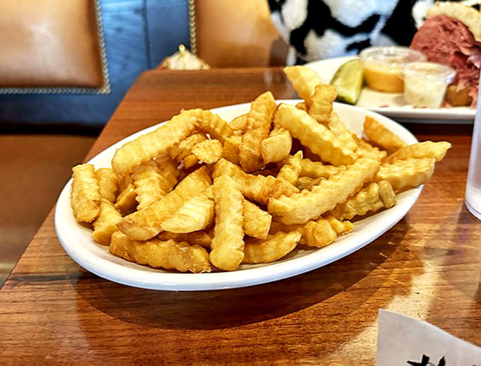 These aren't just french fries, they're supporting actors in the corned beef drama. Crispy, golden, and ready to soak up any wayward Russian dressing.