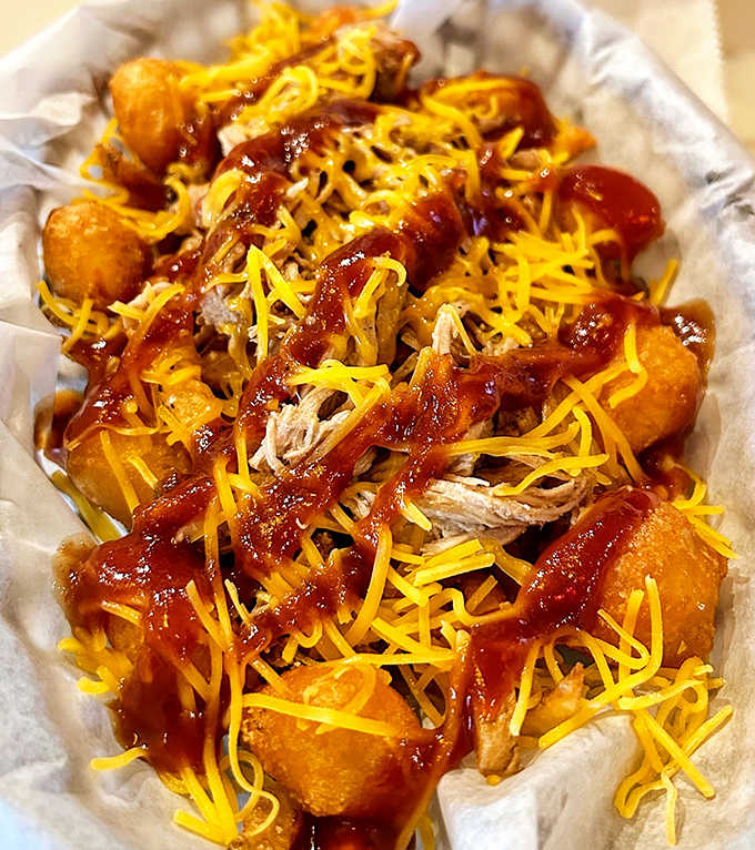 Golden potato nuggets transformed into a festival of flavors with pulled chicken, tangy BBQ sauce and melty cheese.