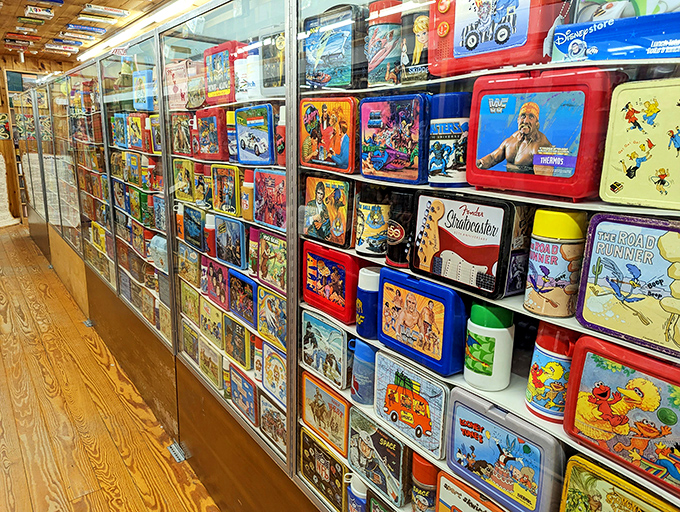 A collector's dream: vintage lunch boxes line the walls like a cafeteria from every decade of American childhood.