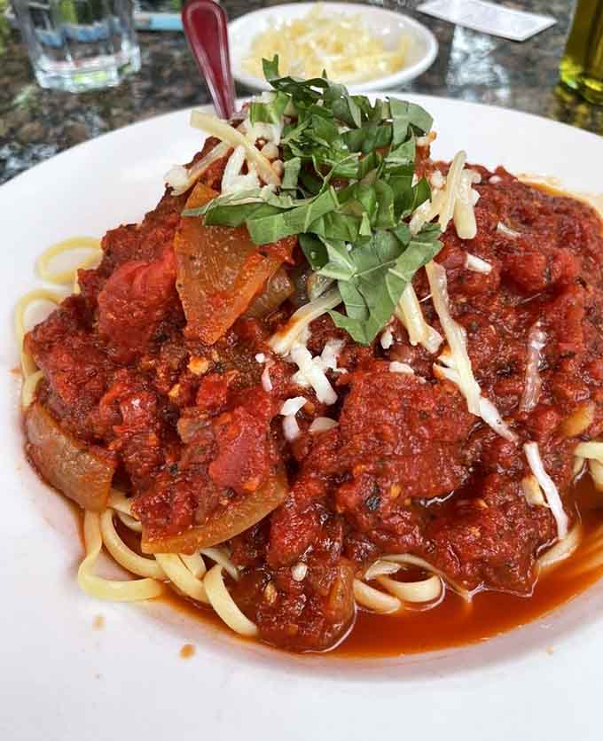 Spaghetti and meatballs transcend their humble origins – each twirl of pasta delivering sauce that's been simmering almost as long as you've been craving it.