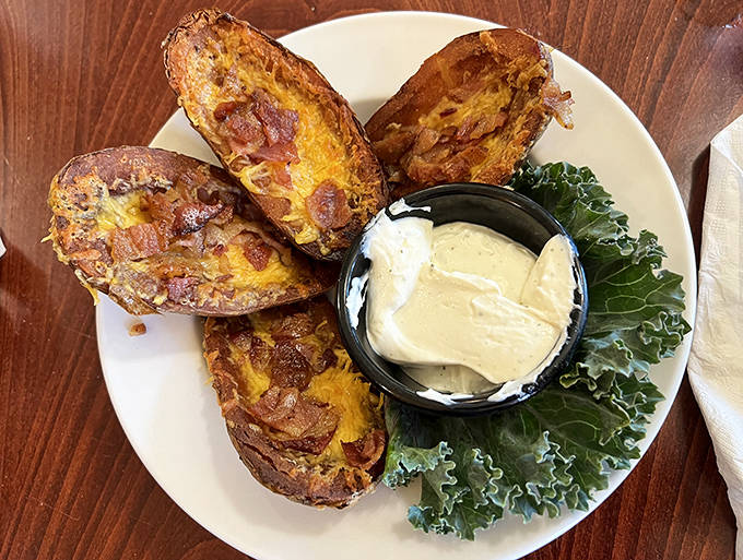 Potato skins that redefine indulgence &ndash; crispy, cheese-laden vessels of comfort that could easily become a meal themselves.