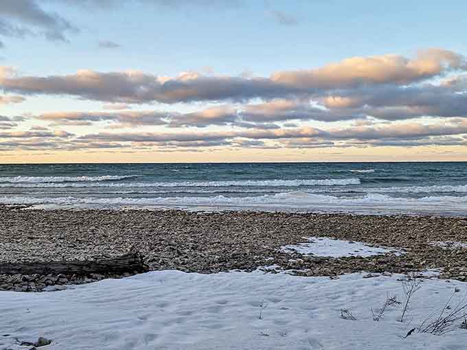 Winter transforms Thompson's Harbor into nature's snow globe, where Lake Huron waves meet icy shores in a breathtaking seasonal remix.