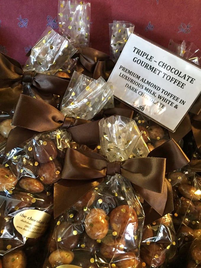 Triple-chocolate gourmet toffee - the holy trinity of chocolate (milk, dark, and white) elevating crunchy almond toffee to new heights.