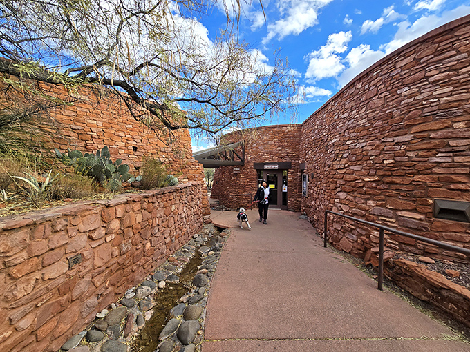 The visitor center blends seamlessly into its surroundings, like a hobbit hole for desert dwellers with excellent taste in stonework.