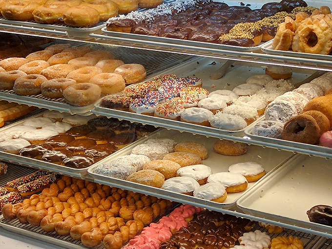 The display case reveals row after row of freshly made delights, a carbohydrate rainbow that makes decision-making deliciously difficult.