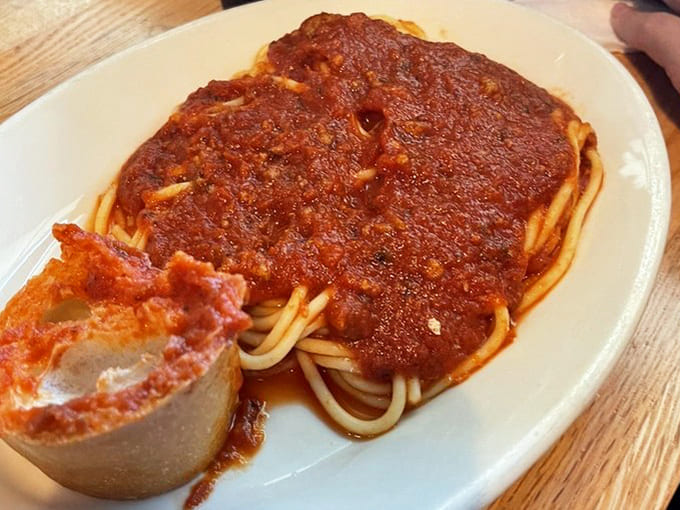 Spaghetti with meat sauce and garlic bread &ndash; the dynamic duo of comfort food that's been solving life's problems one carb-loaded plate at a time.