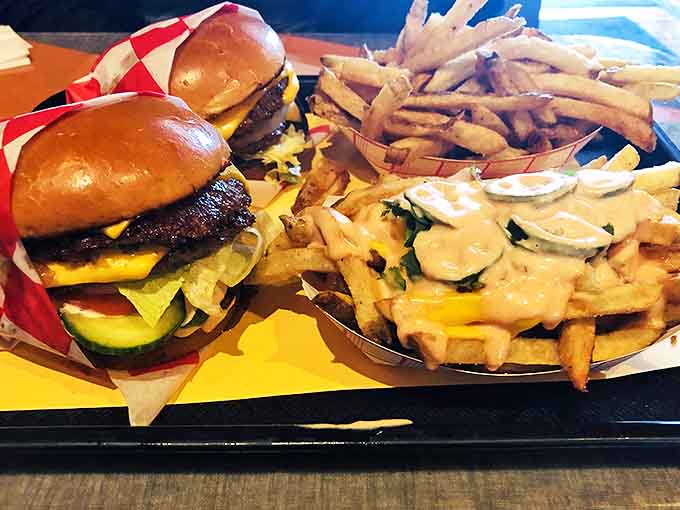 Double Cheeseburger: Behold the architecture of deliciousness – melty cheese cascading over two perfectly seared patties, with a side of crispy-outside, fluffy-inside fries.