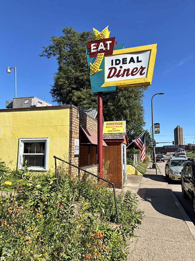 The Ideal Diner's vintage "EAT" sign and bright yellow exterior have been calling hungry Minneapolis diners to Central Avenue for decades.