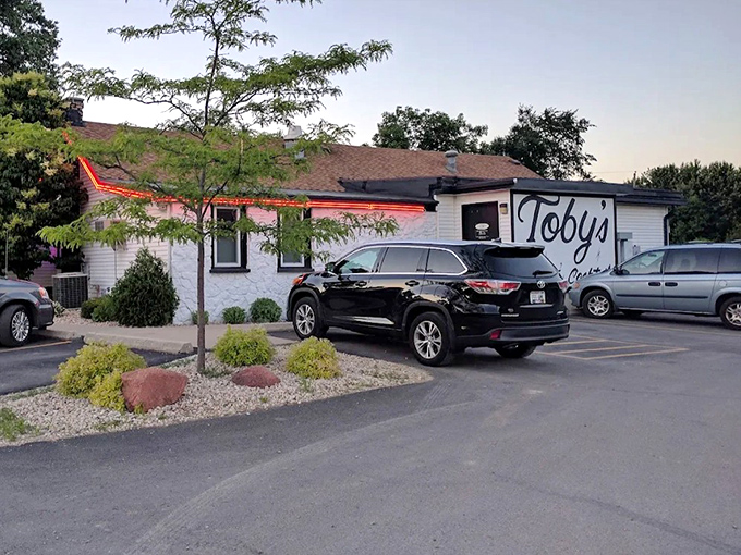The simple white exterior and vintage signage of Toby's Supper Club have become a beloved landmark for generations of Madison diners.