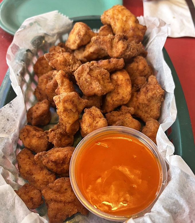 Alligator tenders &ndash; where Florida wildlife meets culinary adventure, these golden nuggets convert skeptics into enthusiasts with one crispy bite.