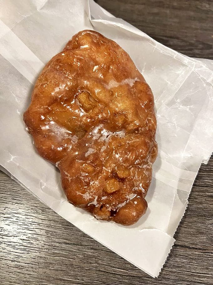 This apple fritter isn't messing around &ndash; it's the heavyweight champion of the display case, with caramelized edges and apple-studded interior.