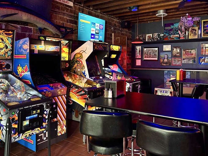 The arcade area beckons with the siren song of flashing lights and electronic bleeps, promising quarters well spent between burger bites.