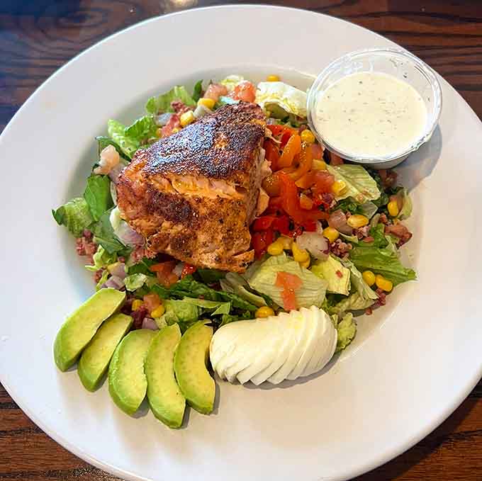 Blackened salmon crowns a colorful Southwest-inspired salad that makes eating healthy feel like a celebration, not a punishment.