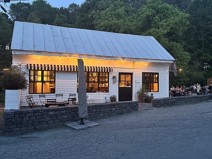 As evening falls, this cozy establishment glows like a beacon for hungry travelers seeking culinary comfort with a touch of sophistication.