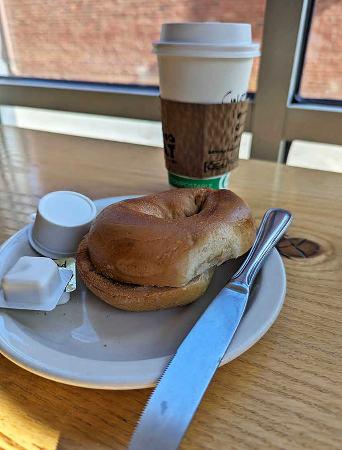 Morning simplicity: a toasted bagel with butter and coffee &ndash; proof that sometimes the most basic combinations are the most satisfying.
