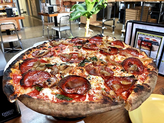 Fresh basil and crispy pepperoni create a flavor tango on this pizza that dances between herbaceous brightness and savory depth.