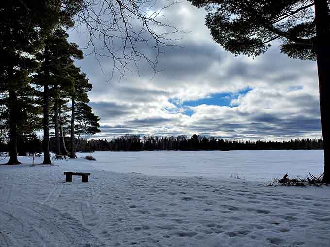Winter transforms the lake into a frozen wonderland that looks like Elsa's vacation home, minus the singing snowman but with better ice fishing.