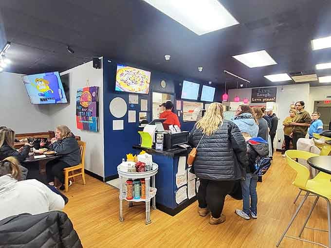 The lunch rush brings a diverse crowd united by one common goal &ndash; getting their hands on pizza that transports them straight to Manhattan.
