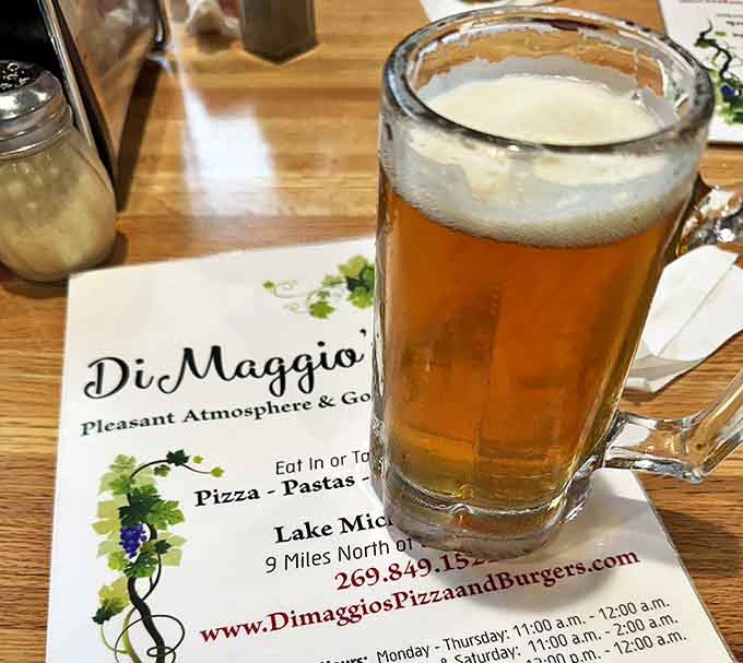 A frosty mug of beer alongside DiMaggio's menu &ndash; the perfect pairing for their legendary pizza in a place where simplicity reigns supreme.