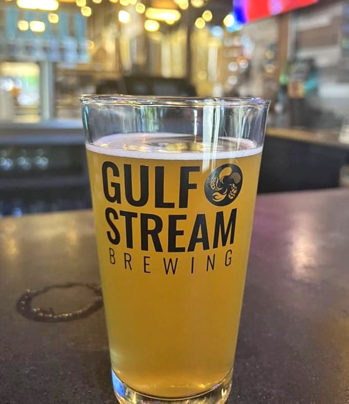 Liquid sunshine captured in a glass, Gulf Stream's golden brew promises refreshment with Florida flair.
