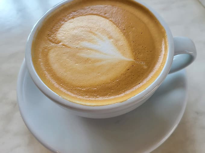 A properly pulled cappuccino with foam art that's almost too pretty to drink, emphasis on almost because it's delicious.