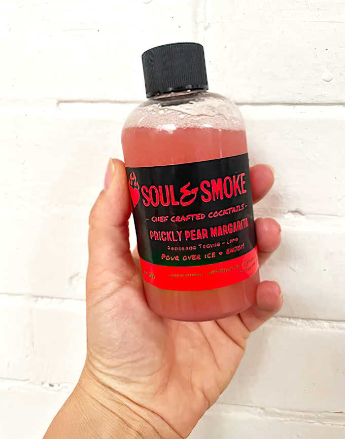 Portable happiness! Their Prickly Pear Margarita proves that great barbecue deserves equally thoughtful libations to wash it all down.